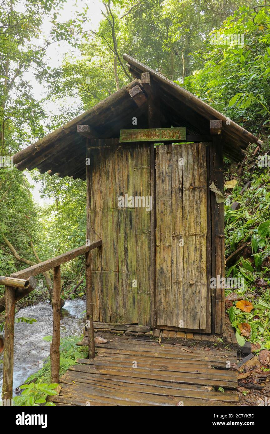 Changing room built of bamboo trunks by a river in a tropical rain ...
