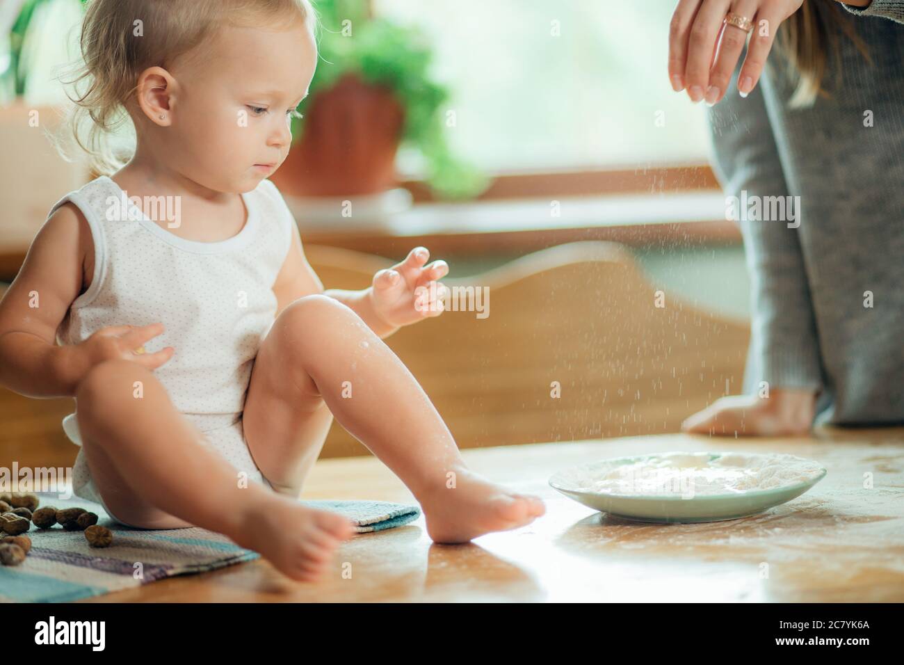 childhood, babyhood and people concept - happy little baby girl sitting ...