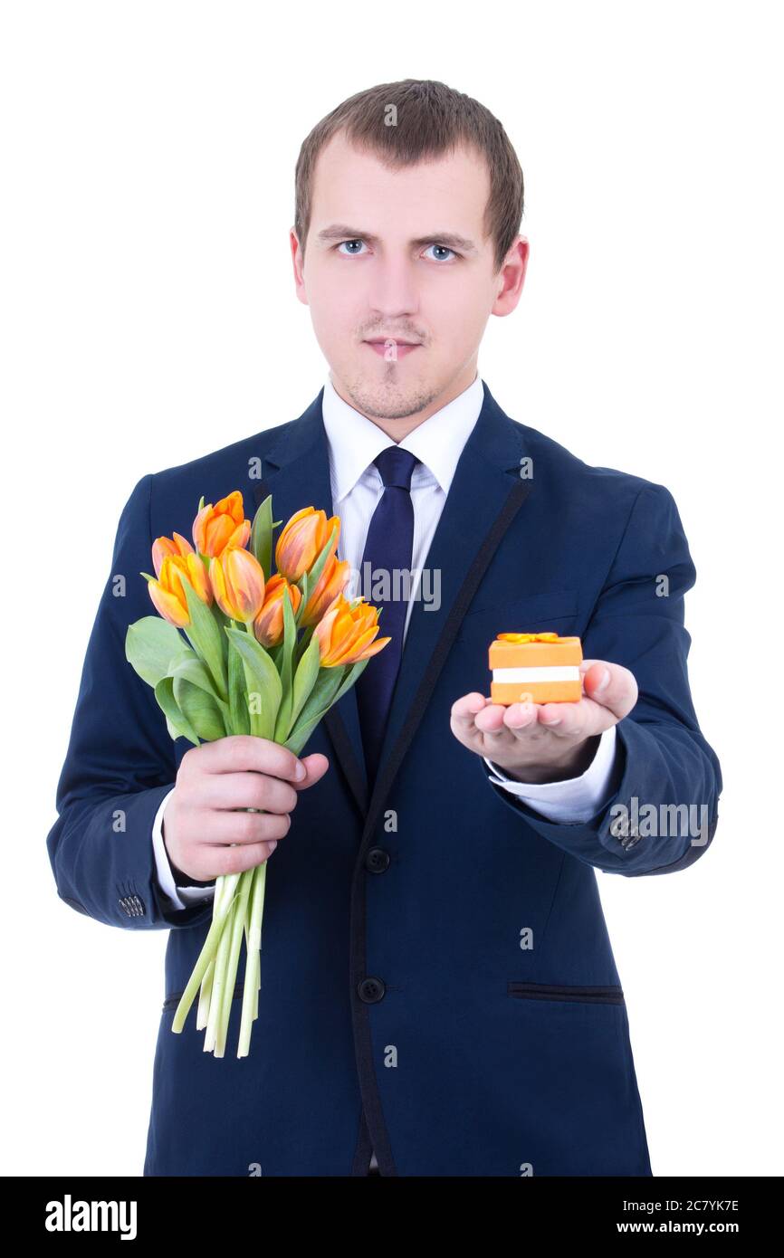 proposal - young man in suit holding gift box with wedding ring and ...