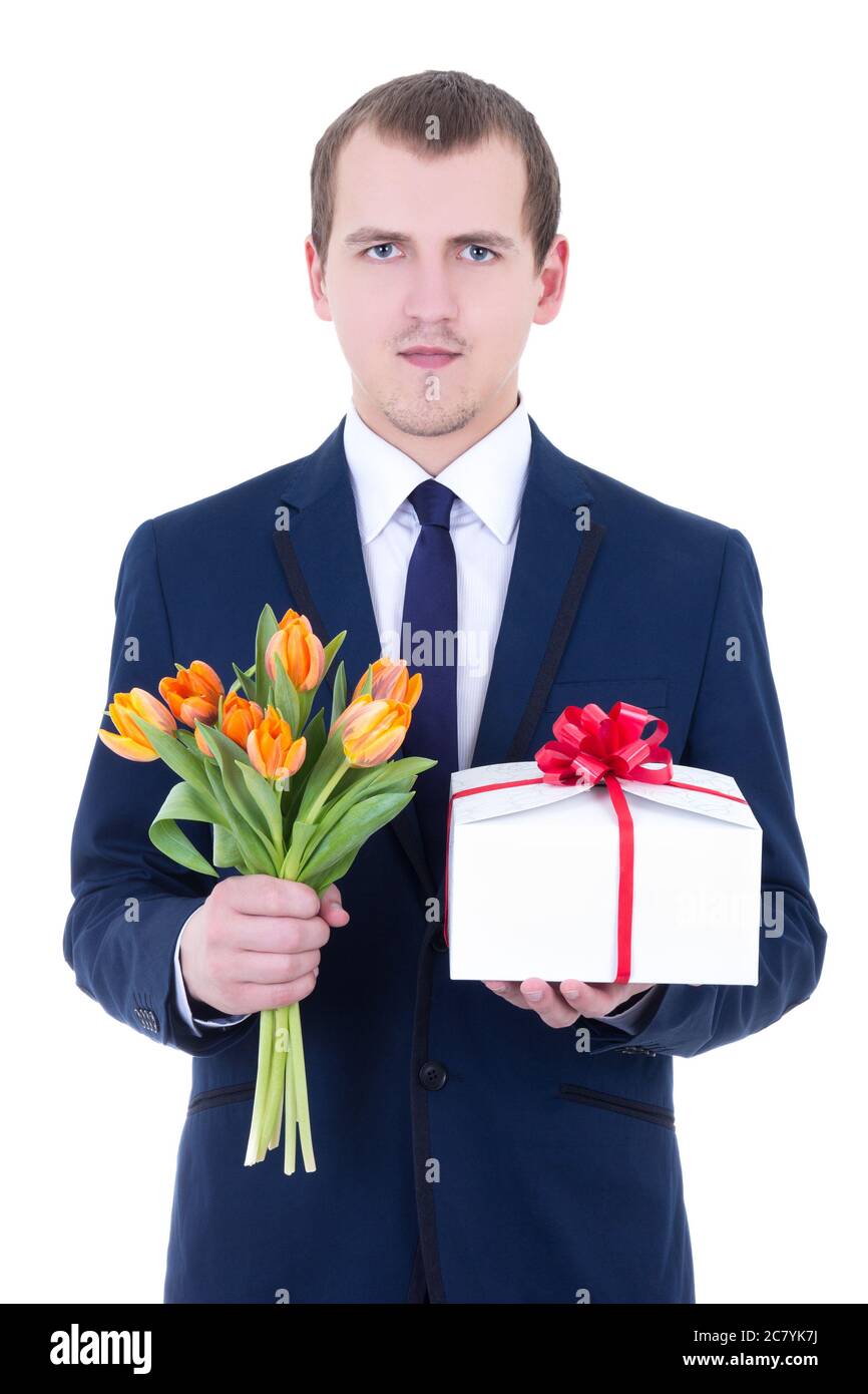 romantic man holding gift box and flowers isolated on white background ...