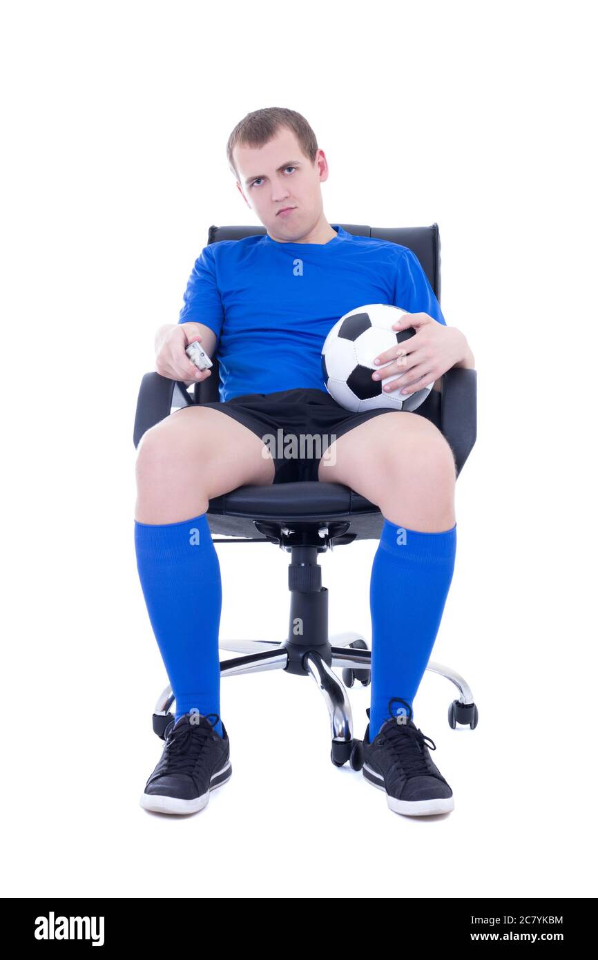 bored man in uniform with remote control watching soccer game isolated ...