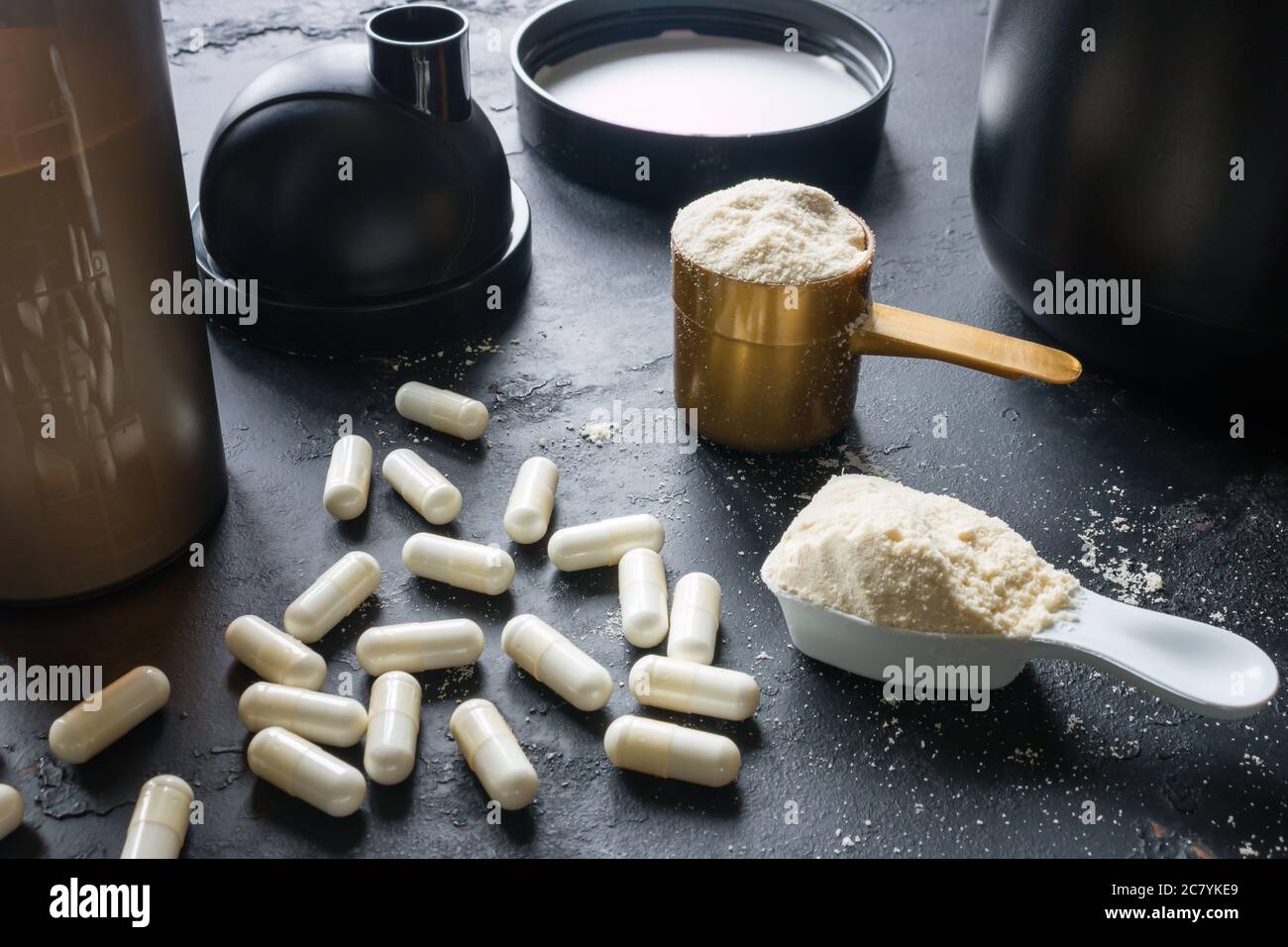 shaker, creatine and protein on a black background Stock Photo - Alamy