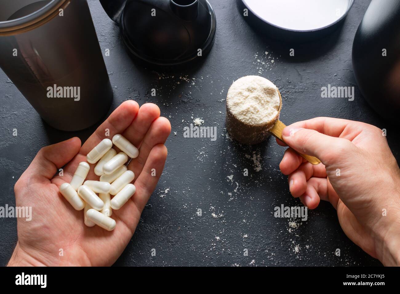 athlete holds various sports supplements Stock Photo - Alamy