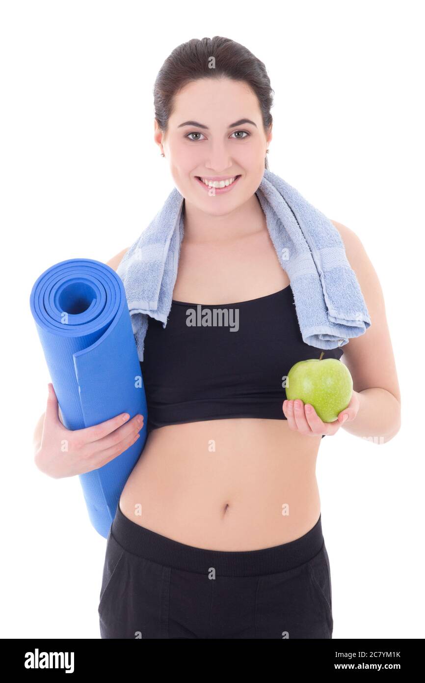 happy slim woman with yoga mat, towel and apple isolated on white ...