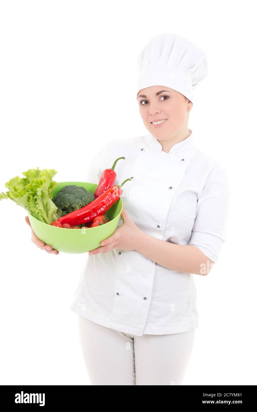 attractive cook woman in uniform with vegetarian food isolated on white ...