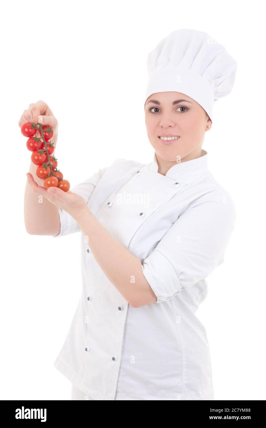 young attractive cook woman in uniform with tomatoes isolated on white ...