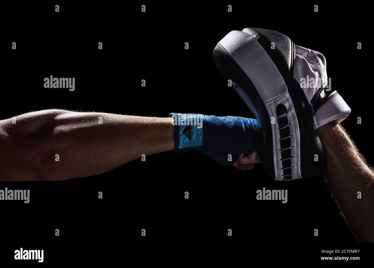 Boxing punch in to Punch Mitts. Training pad. Fighter athlete wrapped ...