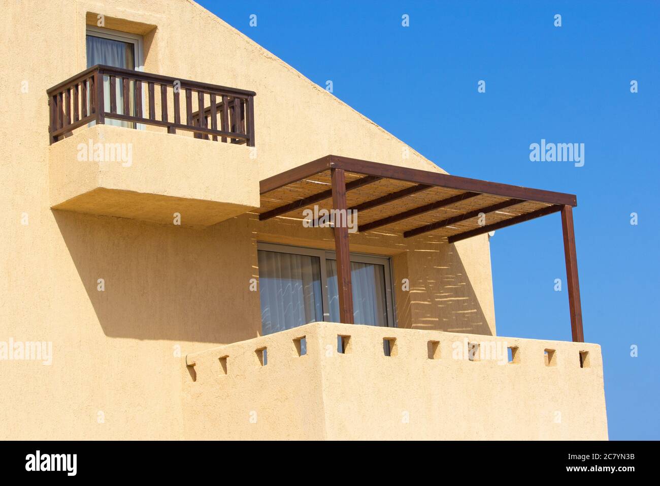 greek traditional house with two balconies over blue sky Stock Photo ...