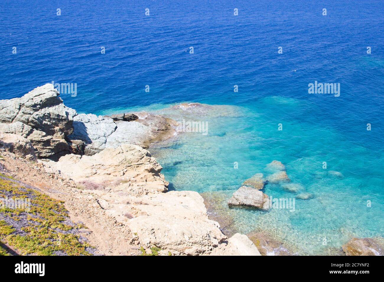 sea scene with transparent water and rocky coast on Crete island in ...