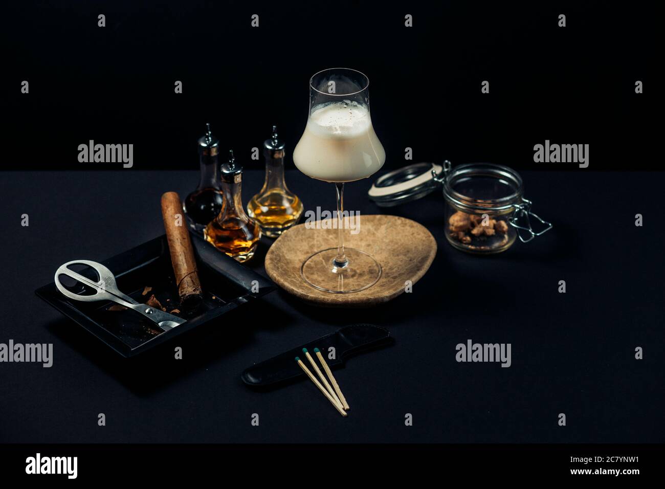 colorful cocktail with a cigar on a beautiful composition with drops ...