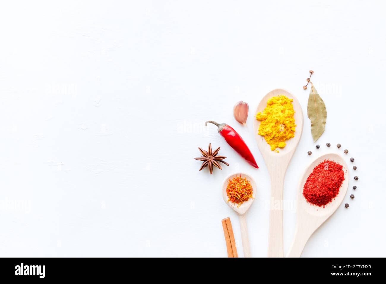 spices and condiments in spoons on a white background mockup Stock ...