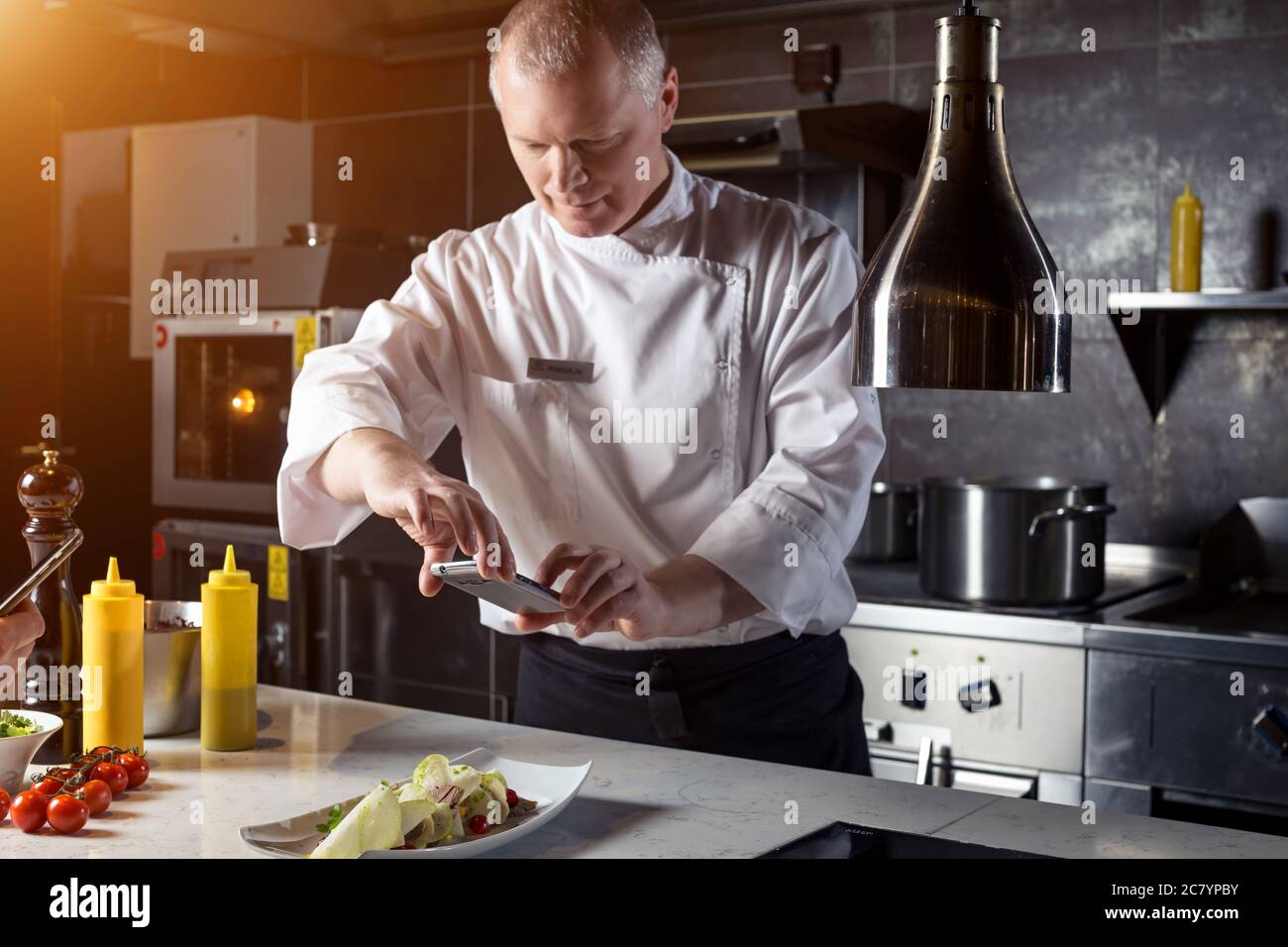 Chef touching food hi-res stock photography and images - Alamy