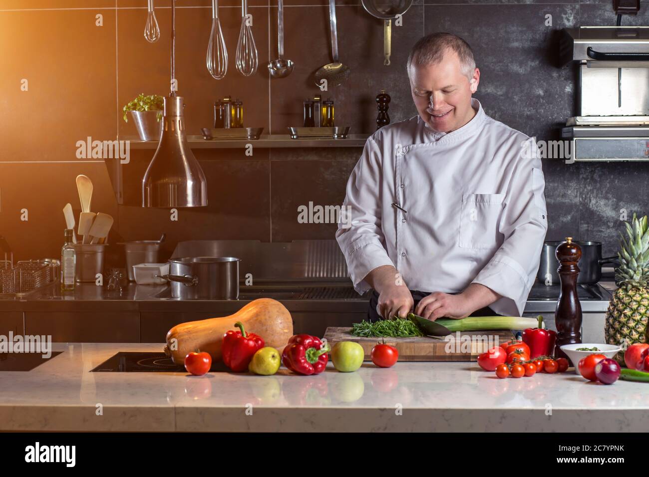 Cook's hands preparing vegetable salad Stock Photo - Alamy