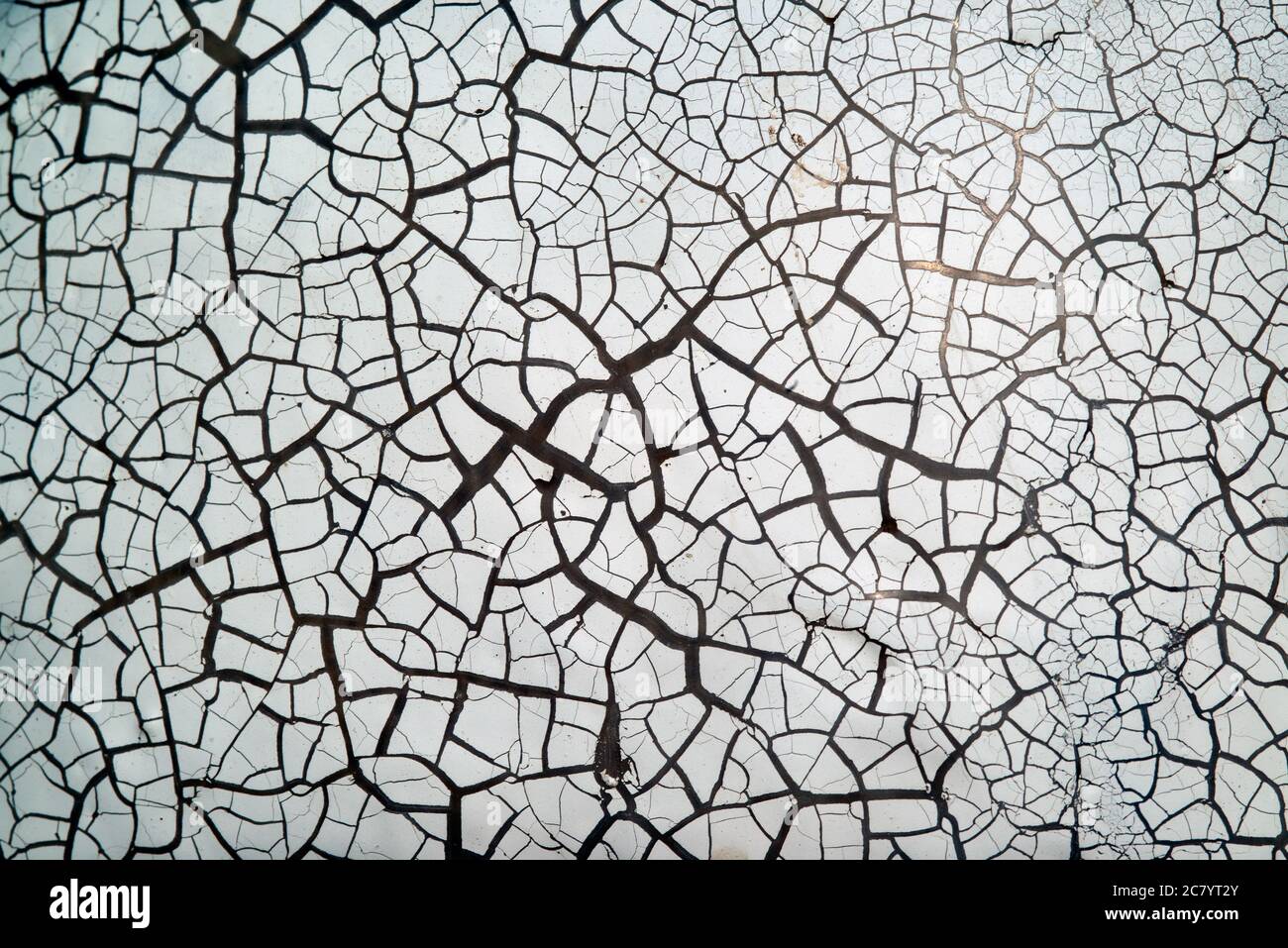 The surface is close to colour and cracks in white background Stock ...