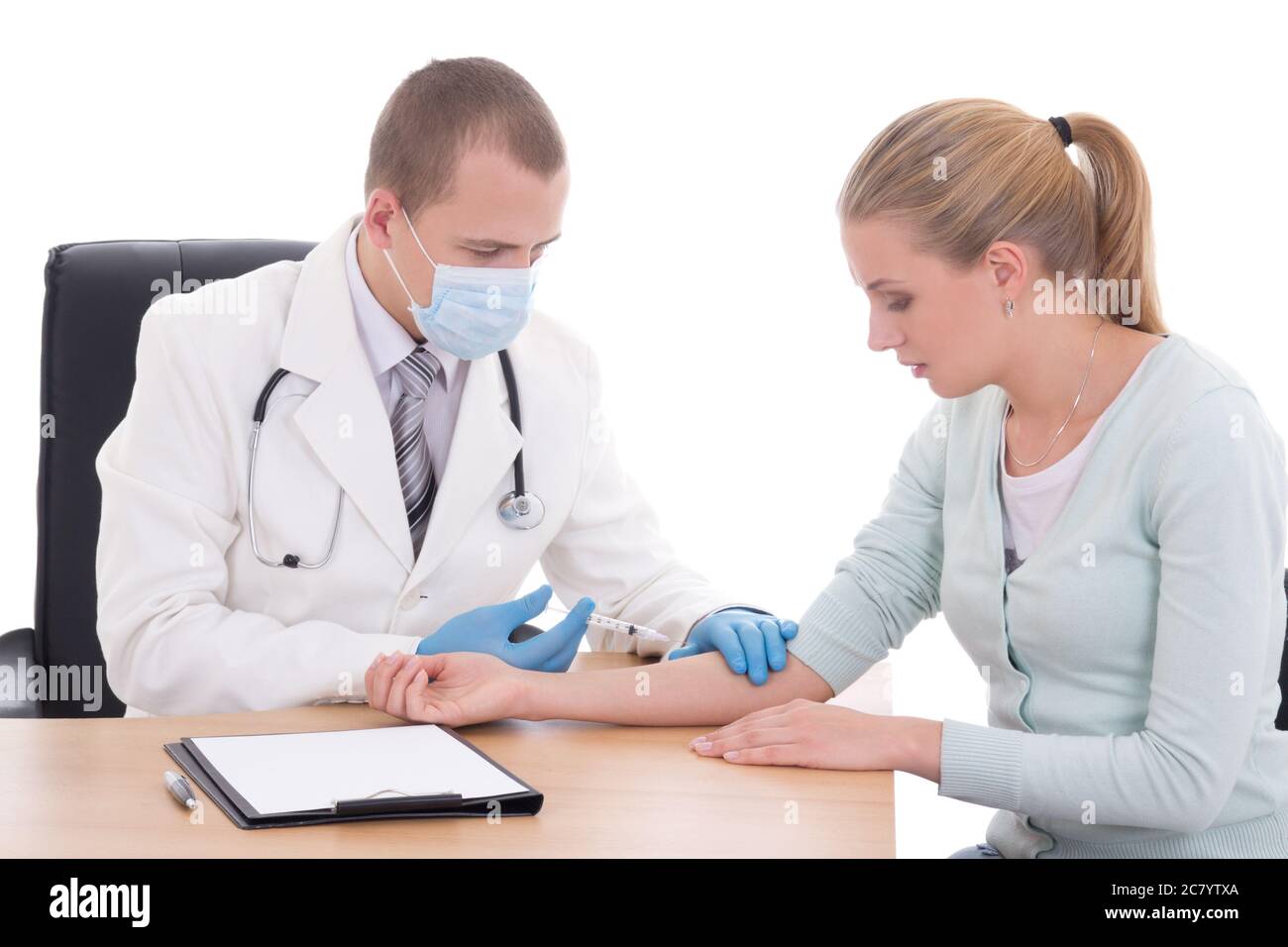 young doctor making the patient an injection isolated on white ...
