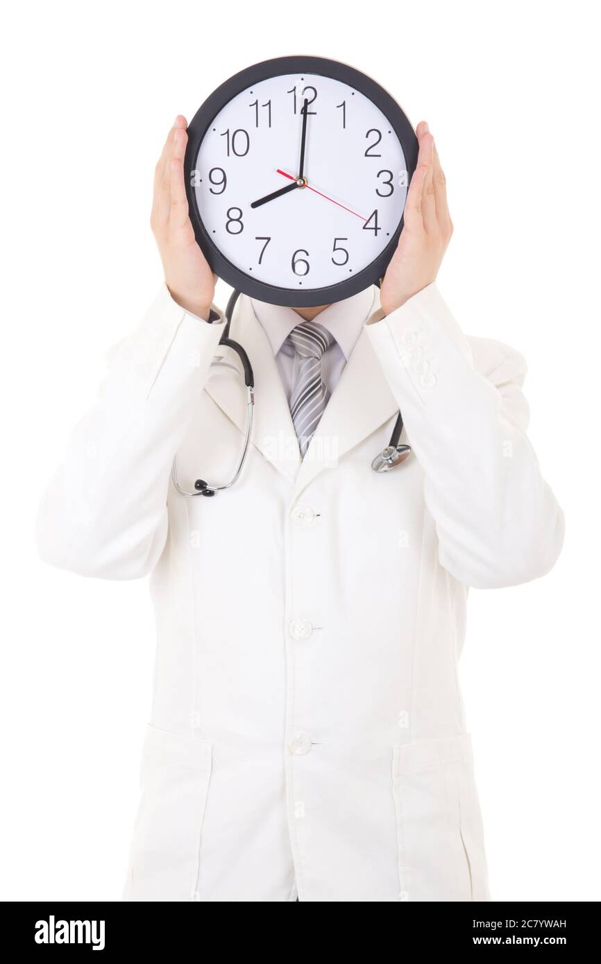 male doctor holding clock in front of face isolated on white background ...