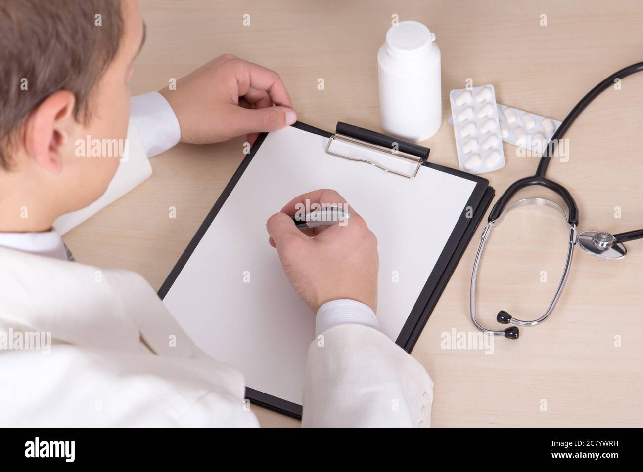 General practitioner prescribing medicine hi-res stock photography and ...