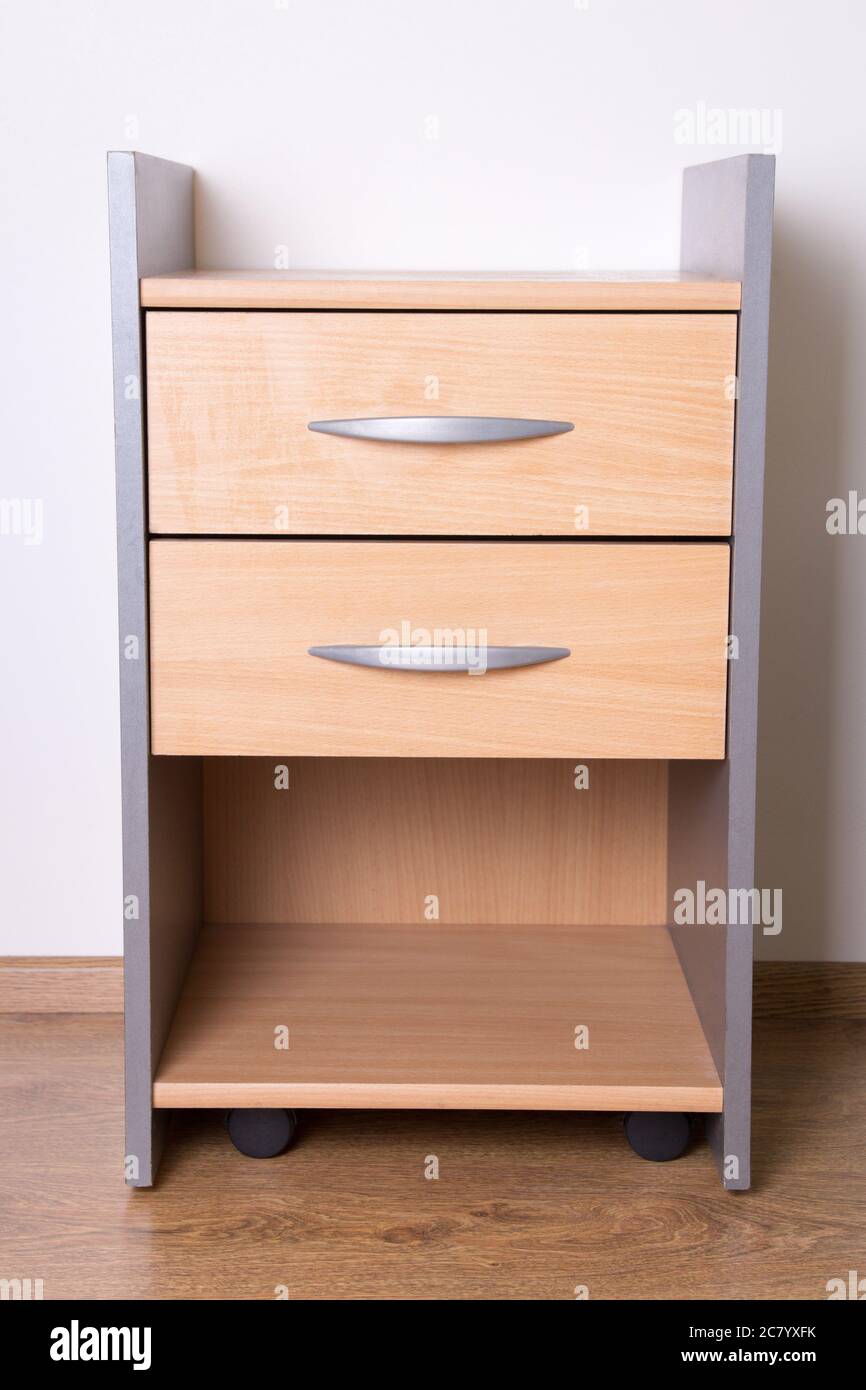 modern wooden nightstand on the floor in bedroom Stock Photo - Alamy