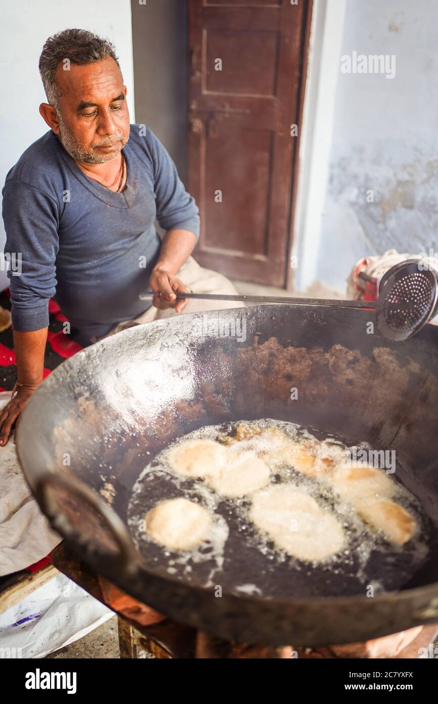 Indian man frying hi-res stock photography and images - Alamy