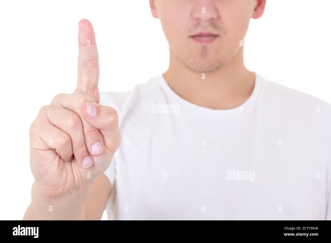 close up of young man pointing upwards isolated on white background ...
