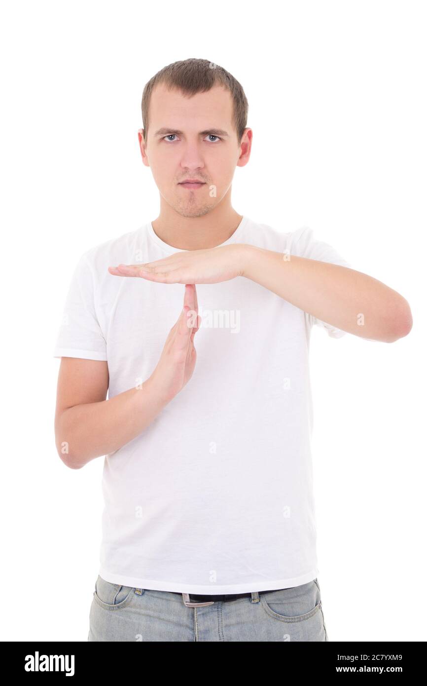 Portrait of young man gesturing time out sign isolated on white ...