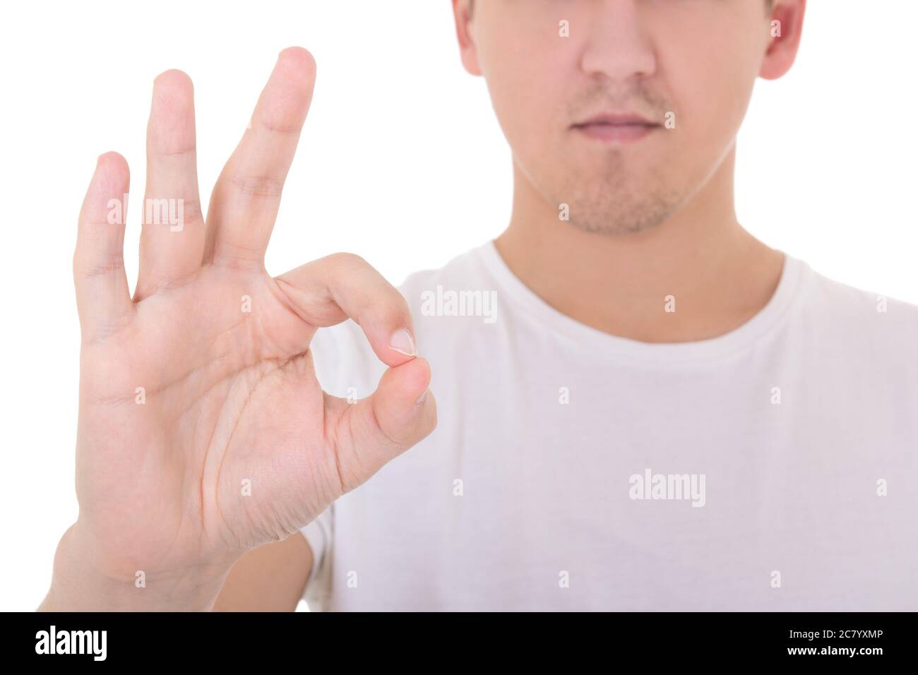 close up of young attractive man showing okay sign isolated on white ...