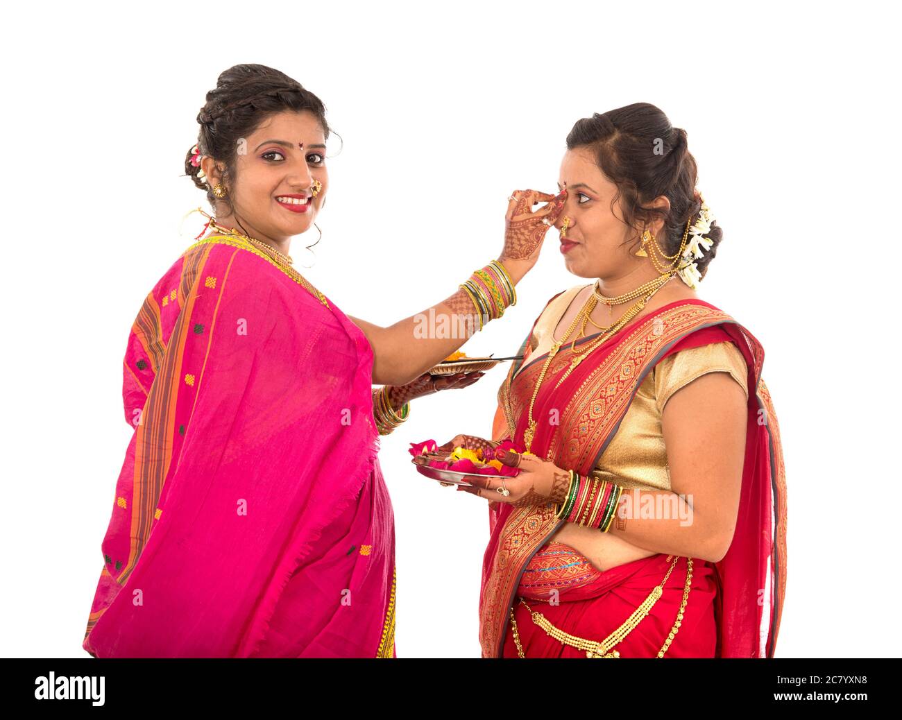 Portrait of Indian Traditional Girls holding diya and flower thali ...