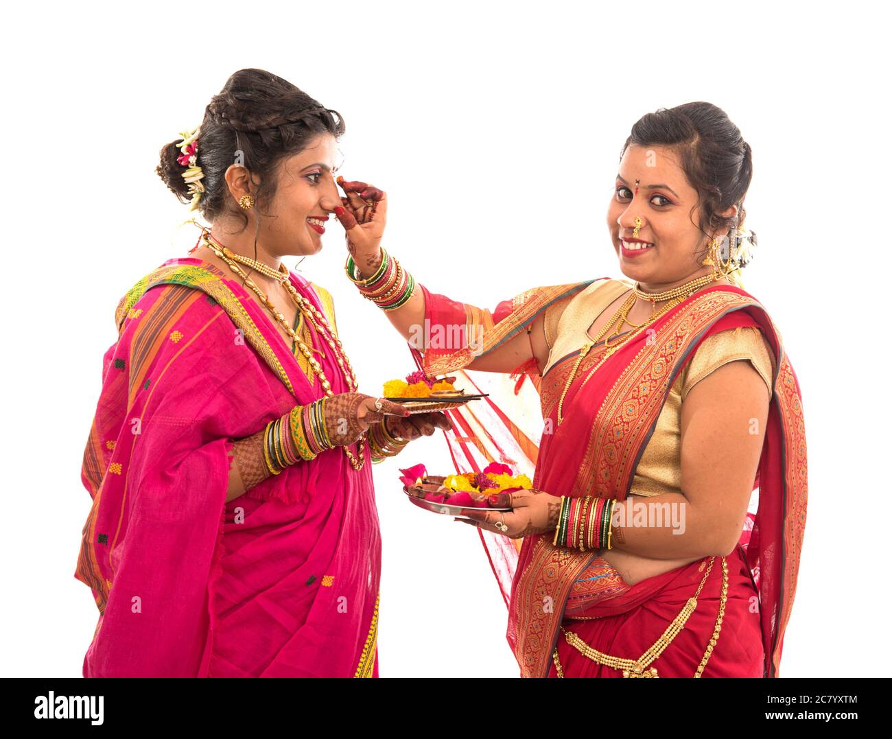 Portrait of Indian Traditional Girls holding diya and flower thali ...