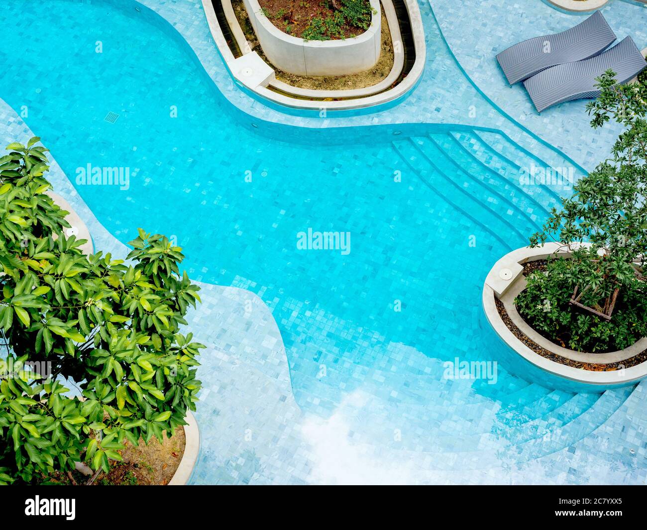 Tiletop view of modern swimming pool blue curved swimming pool hi-res ...