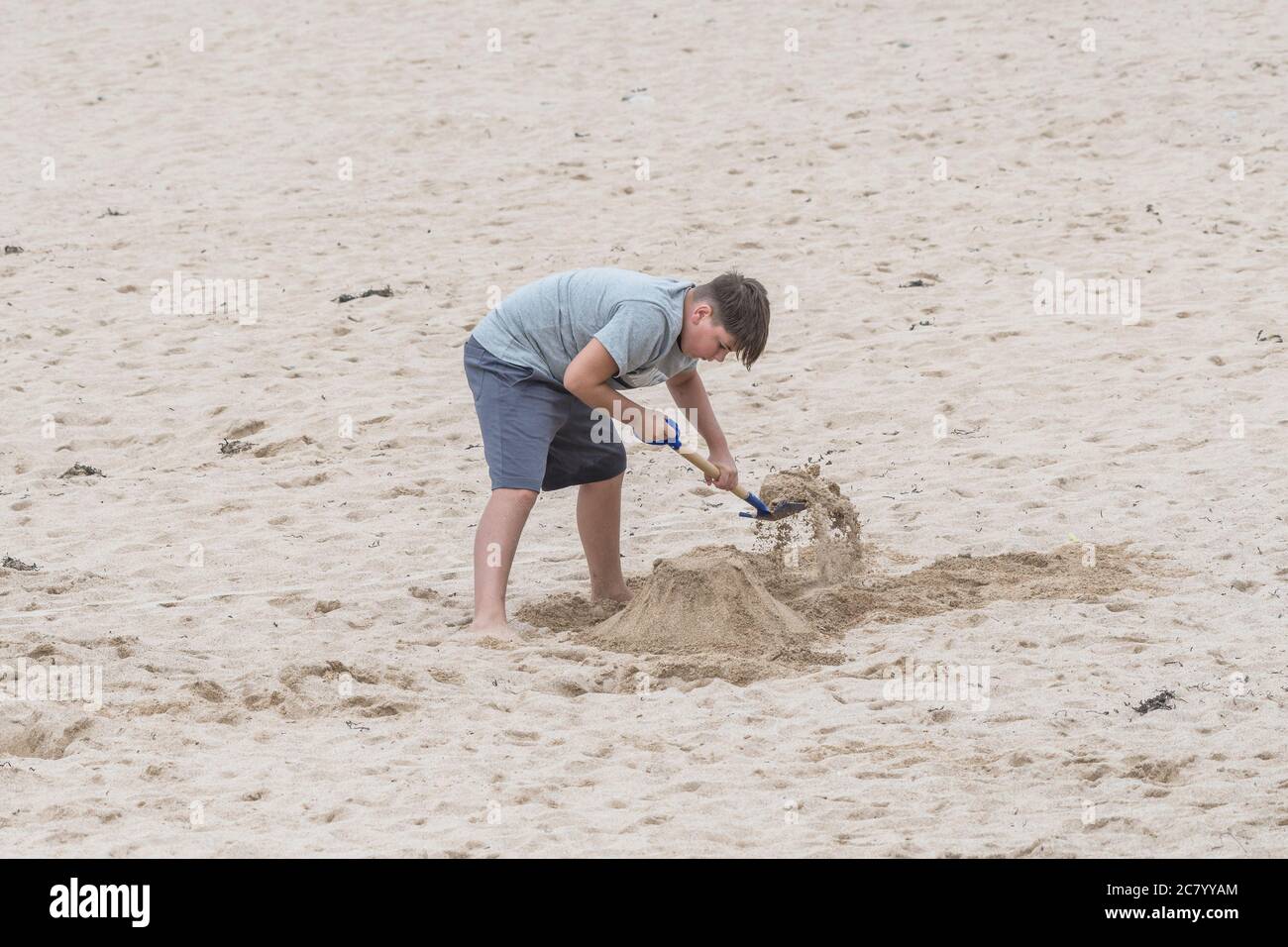 Boy using spade hi-res stock photography and images - Alamy