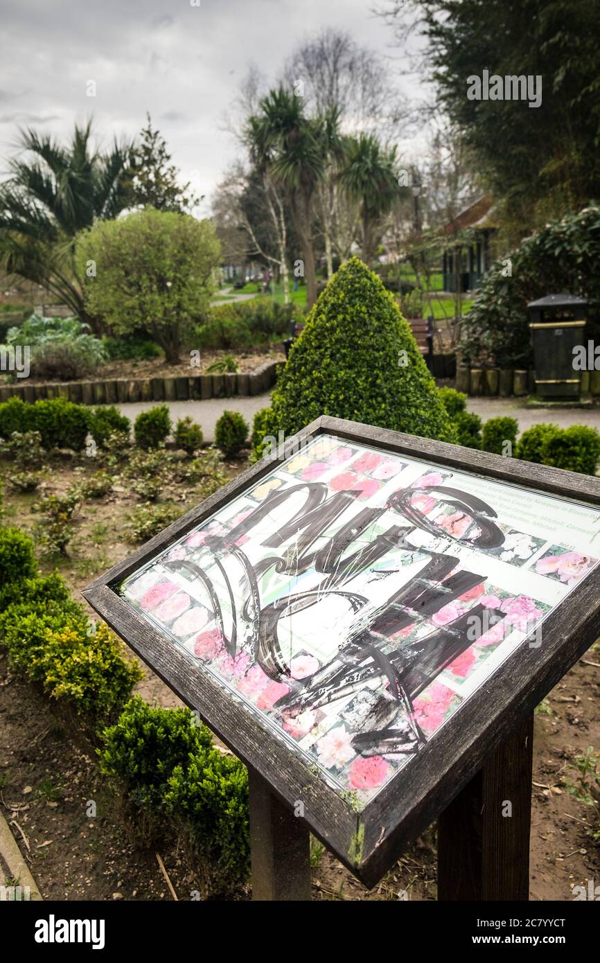 An information board defaced and damaged by graffiti tagging in ...