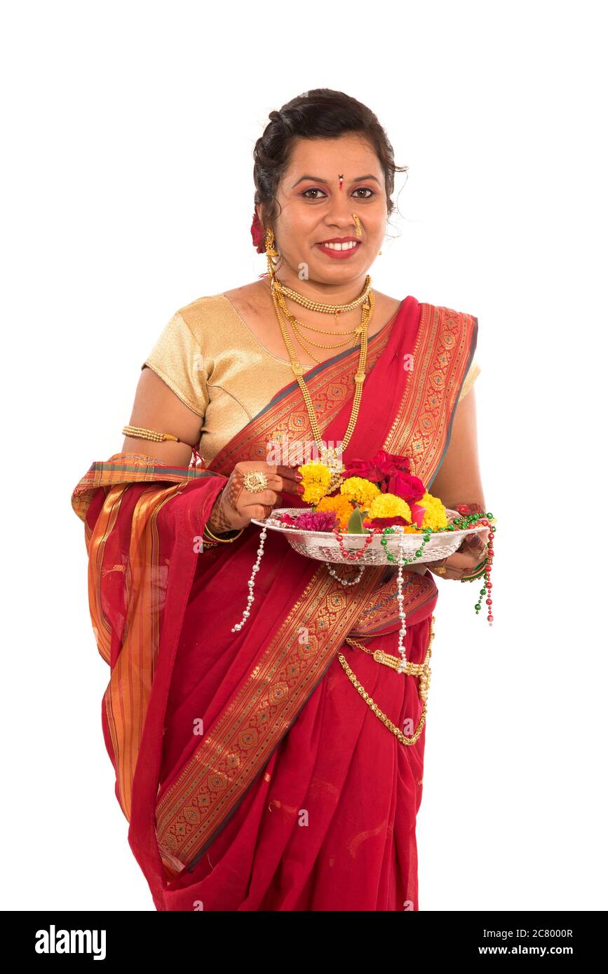 Beautiful Indian woman holding flower thali Stock Photo - Alamy
