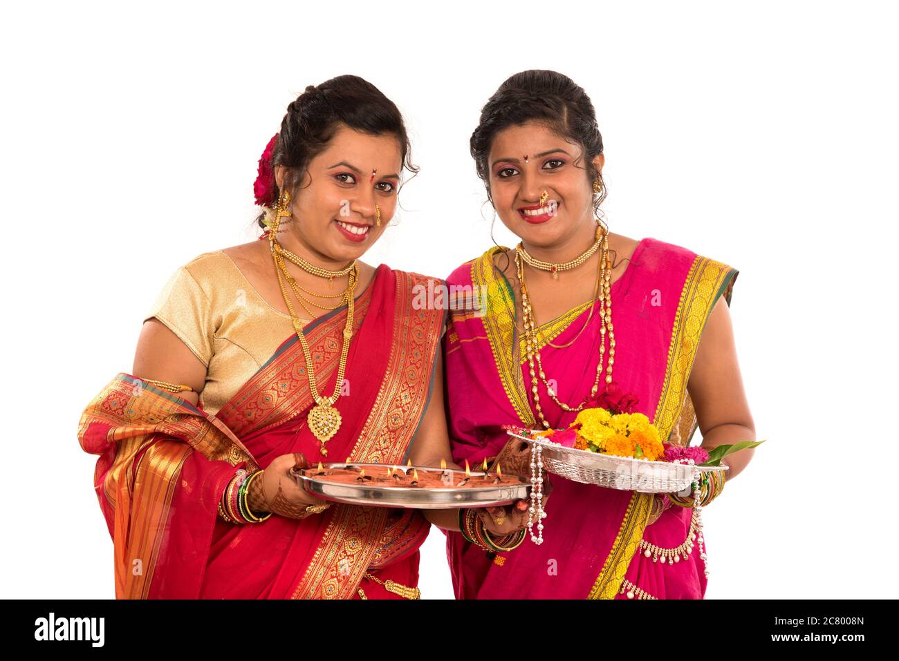 Portrait of Indian Traditional Girls holding diya and flower thali ...