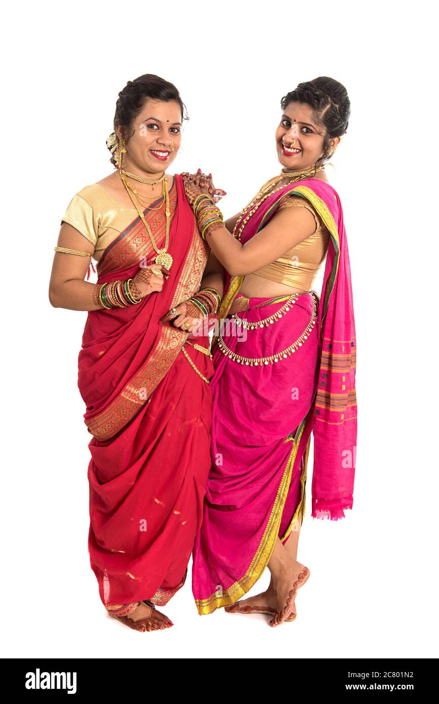 Traditional Beautiful Indian young girls in saree posing on white ...
