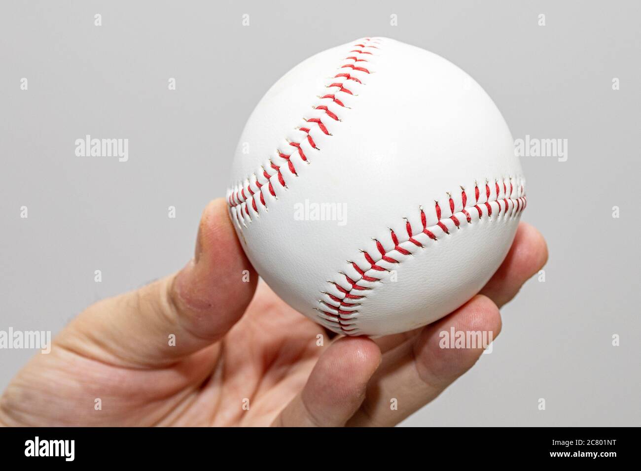 baseball ball white sport hand holding game Stock Photo - Alamy