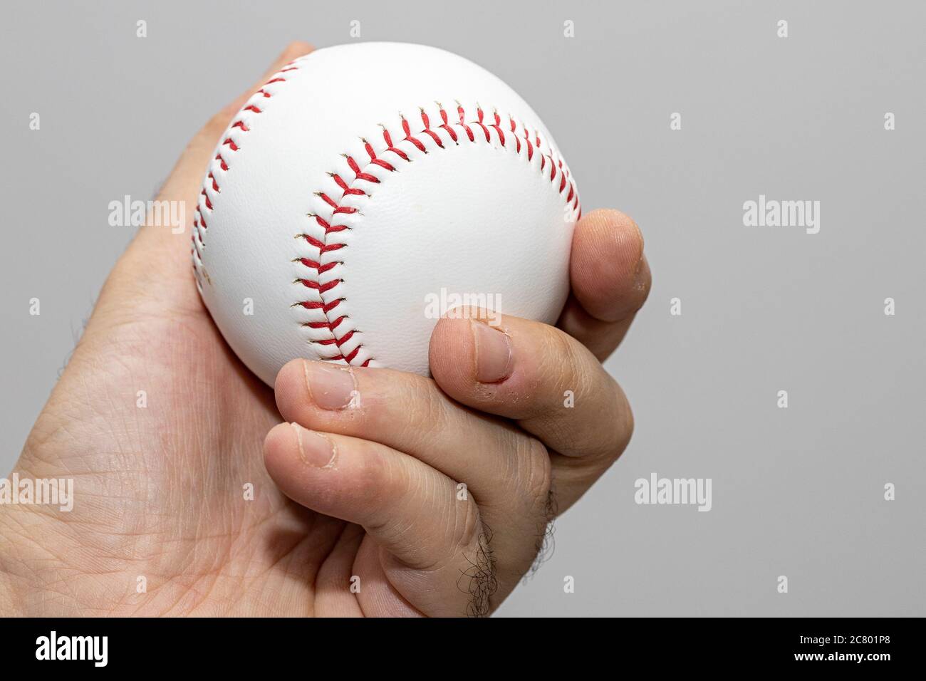baseball ball white sport hand holding game Stock Photo - Alamy