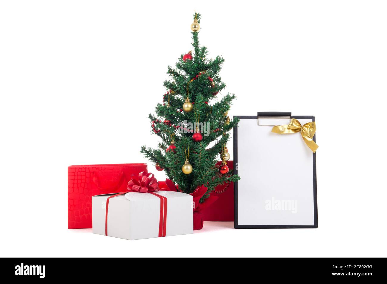 decorated christmas tree, gift boxes and gift list isolated on white ...
