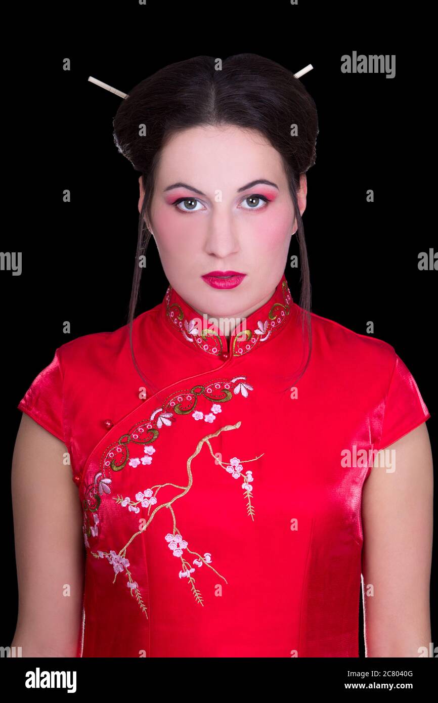 portrait of girl in red japanese dress isolated on black background ...