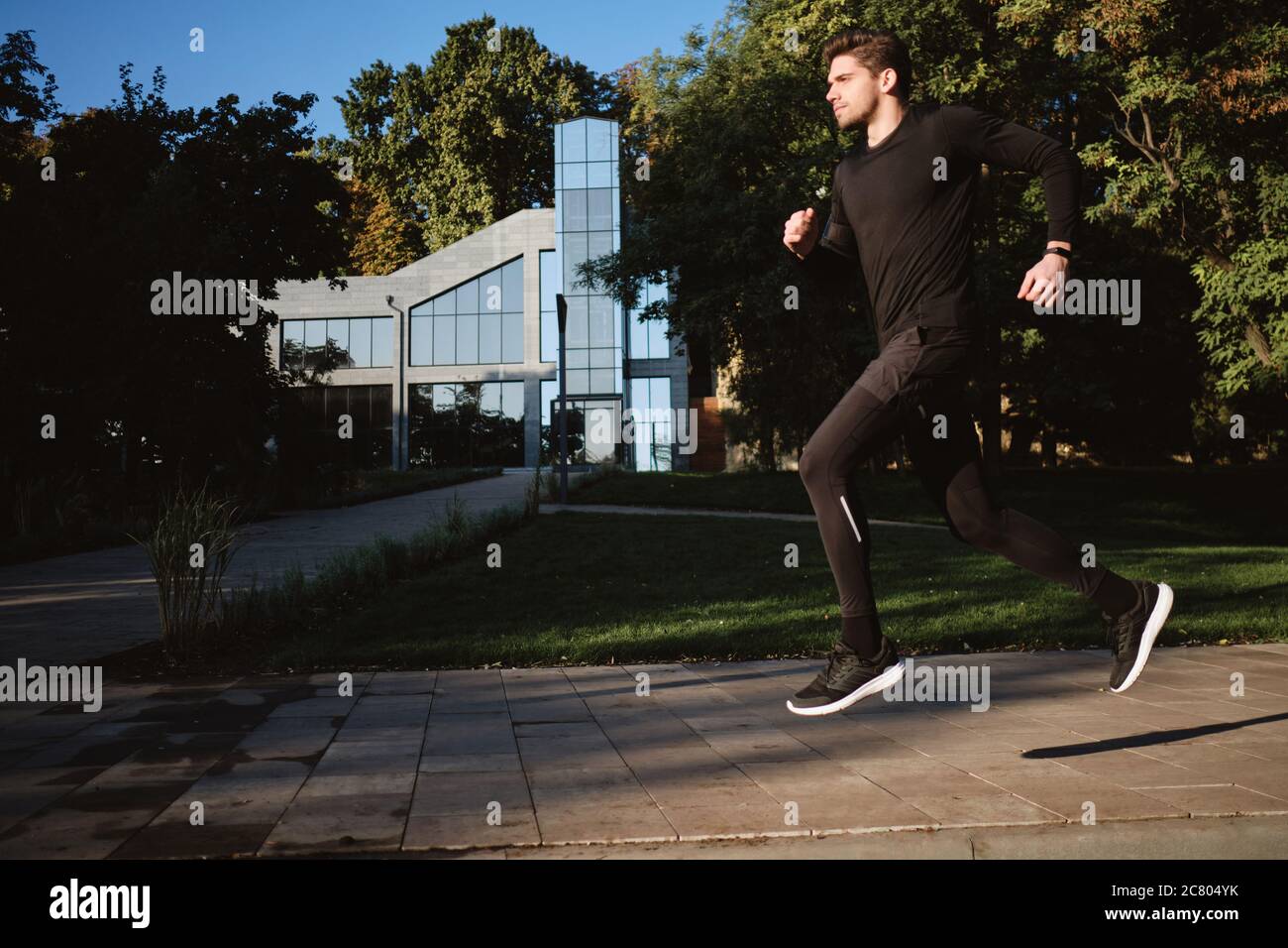 Attractive young man running athlete hi-res stock photography and ...