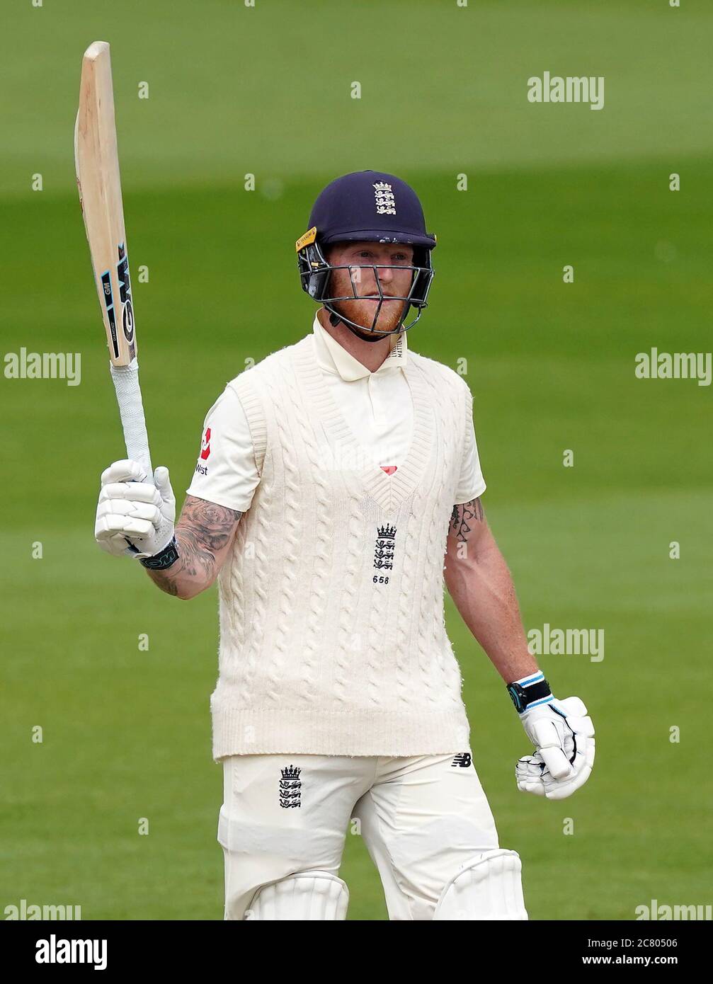 England’s Ben Stokes raises his bat after reaching his half century ...