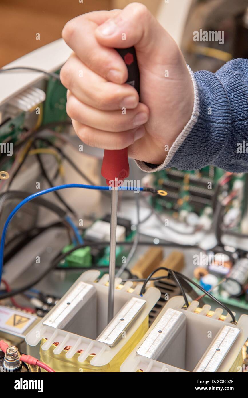 Hand holding electrical wires hi-res stock photography and images - Alamy