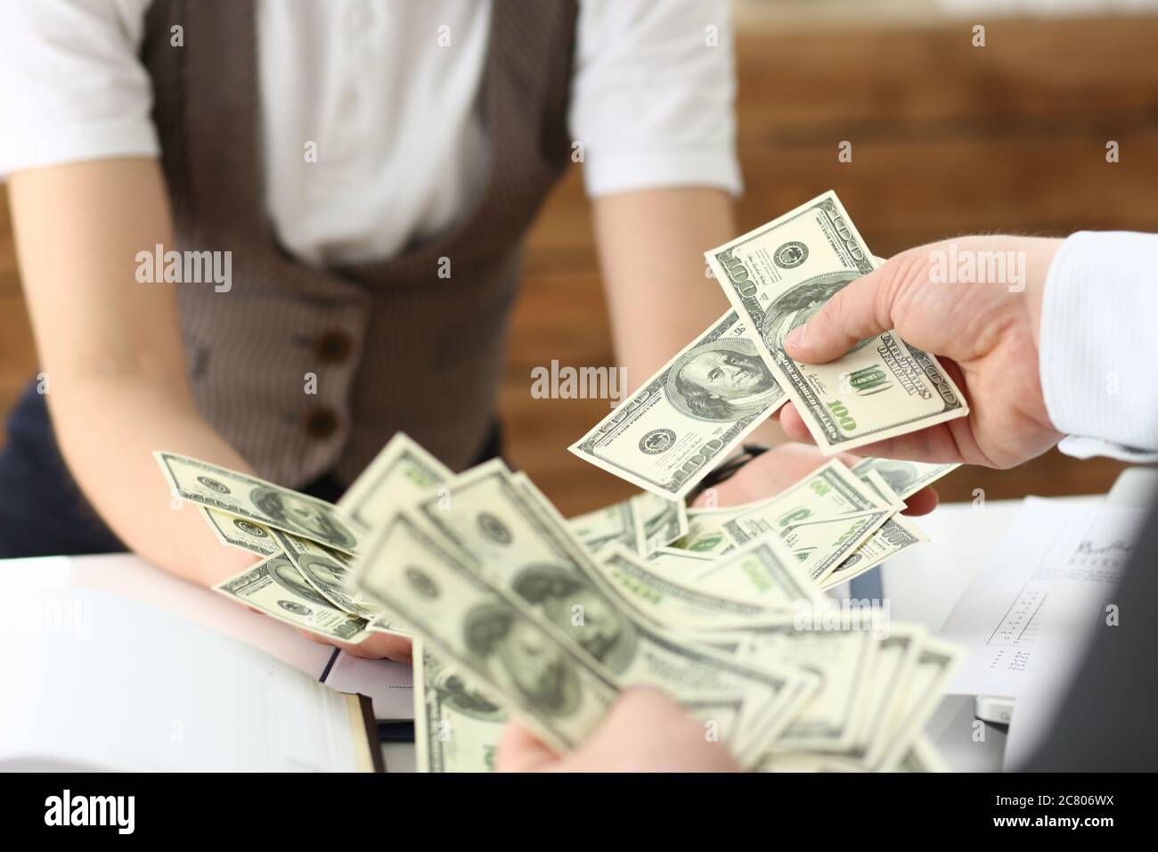 Man giving money in office hi-res stock photography and images - Alamy