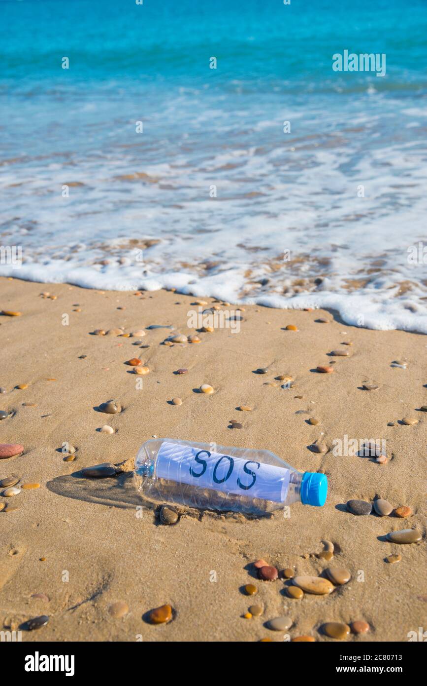 Sea plastic contamination. SOS message in a plastic bottle on the sea ...