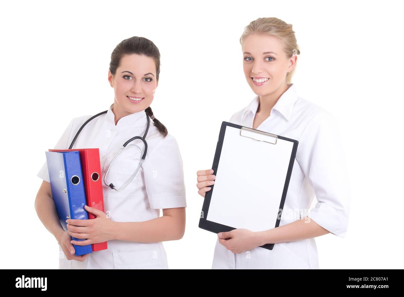 two beautiful nurses with folders over white. copyspace Stock Photo - Alamy