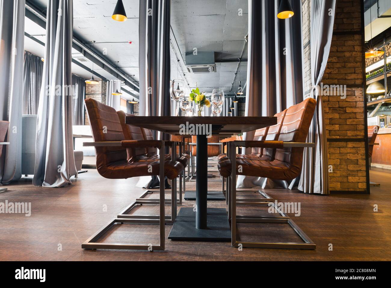interior loft style restaurant with leather chairs Stock Photo - Alamy