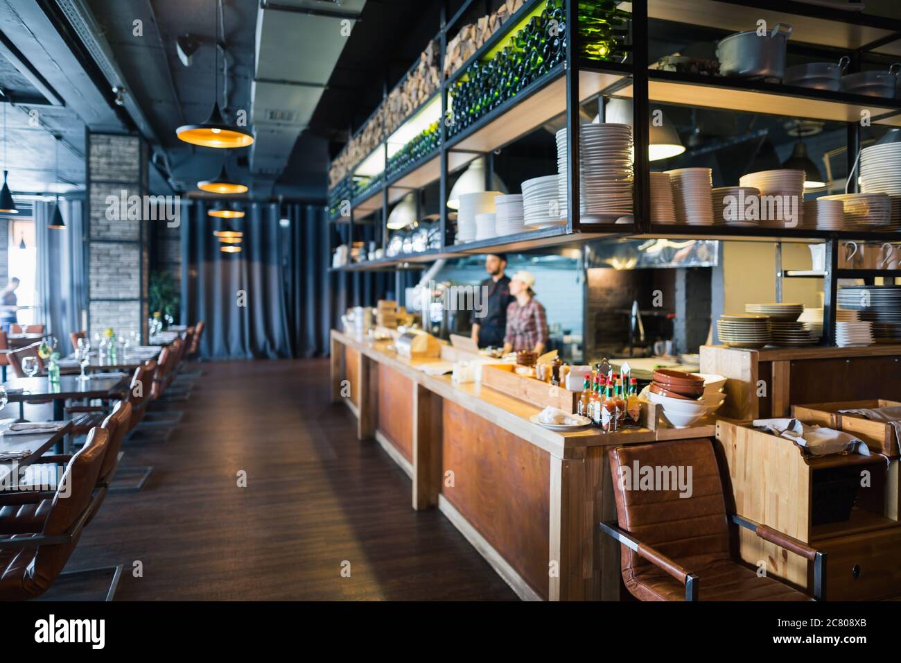 Restaurant kitchen interior: bar counter made of natural stone, fences ...