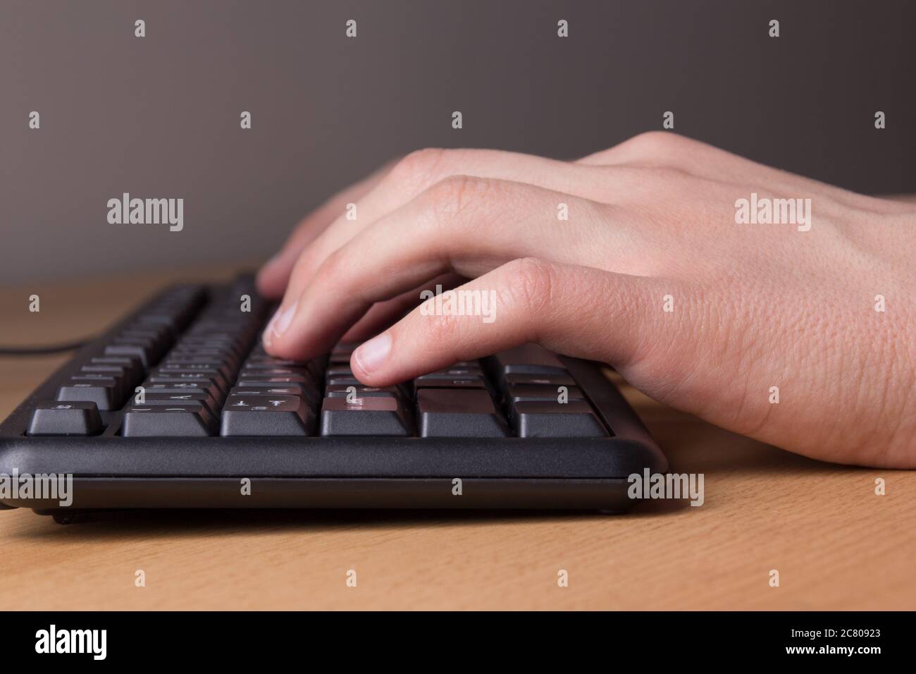typing male hands on pc keyboard Stock Photo - Alamy