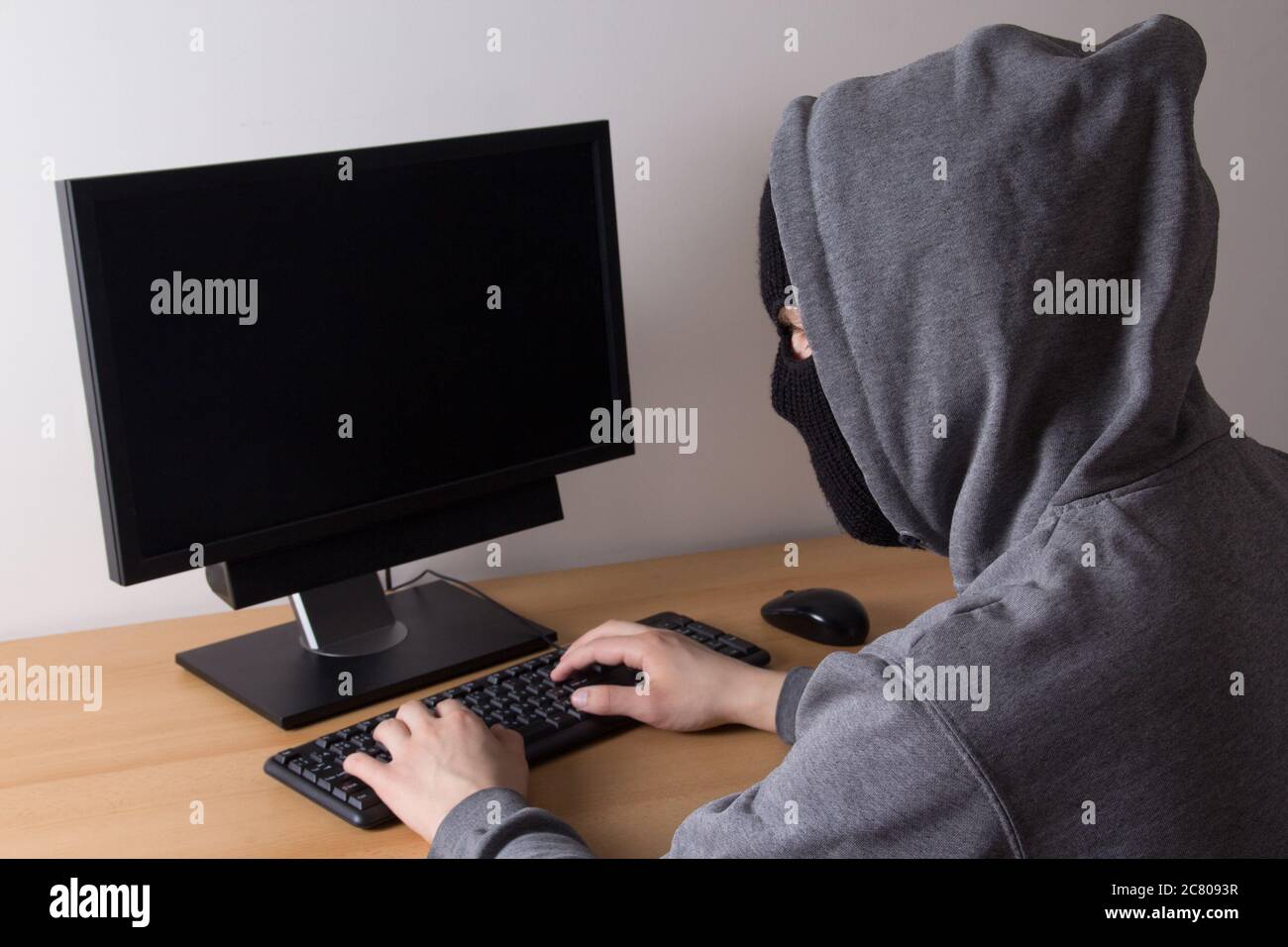male thief stealing data from pc Stock Photo - Alamy