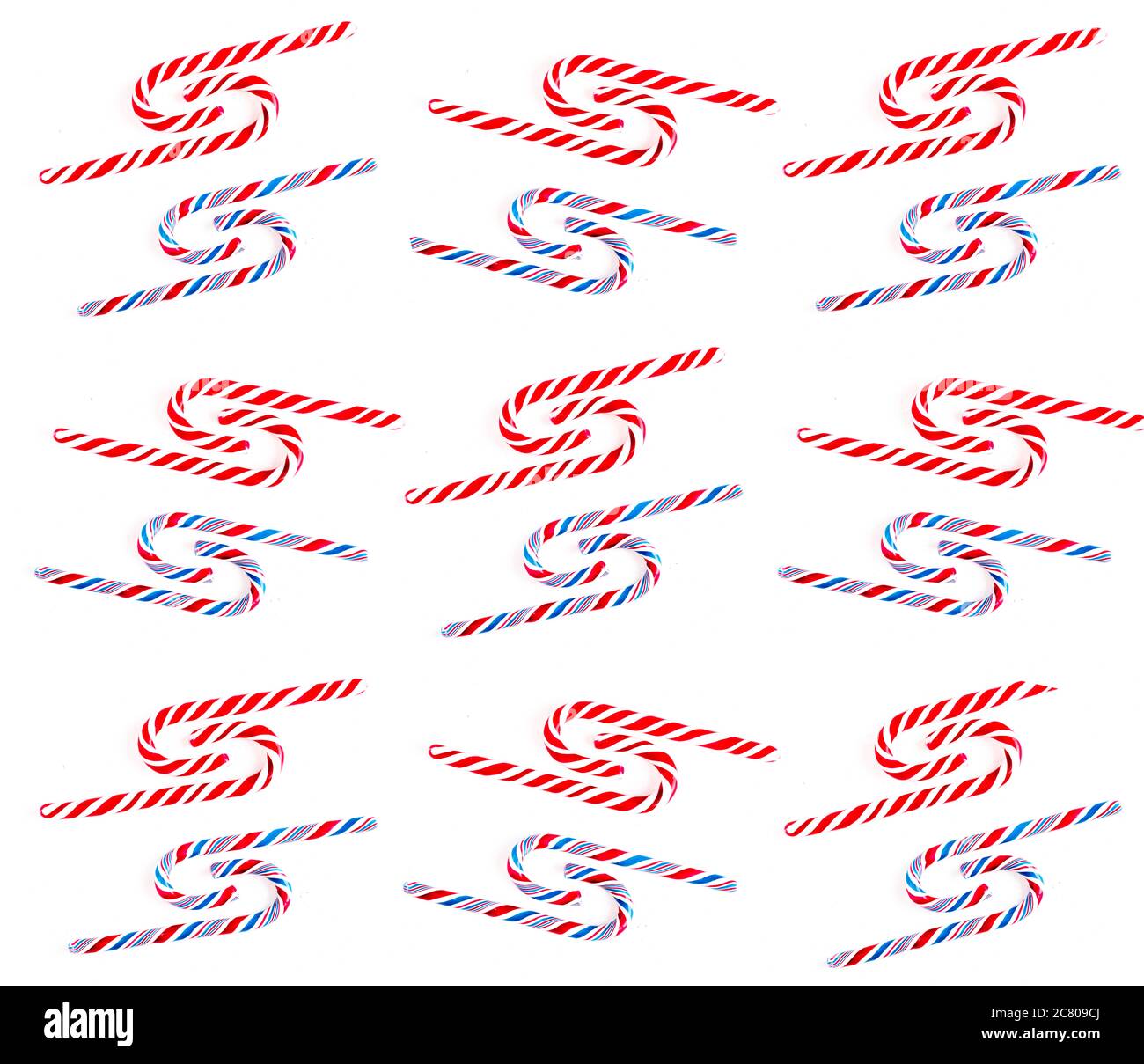 Christmas candy cane pattern on blue white background. Flat lay Stock ...
