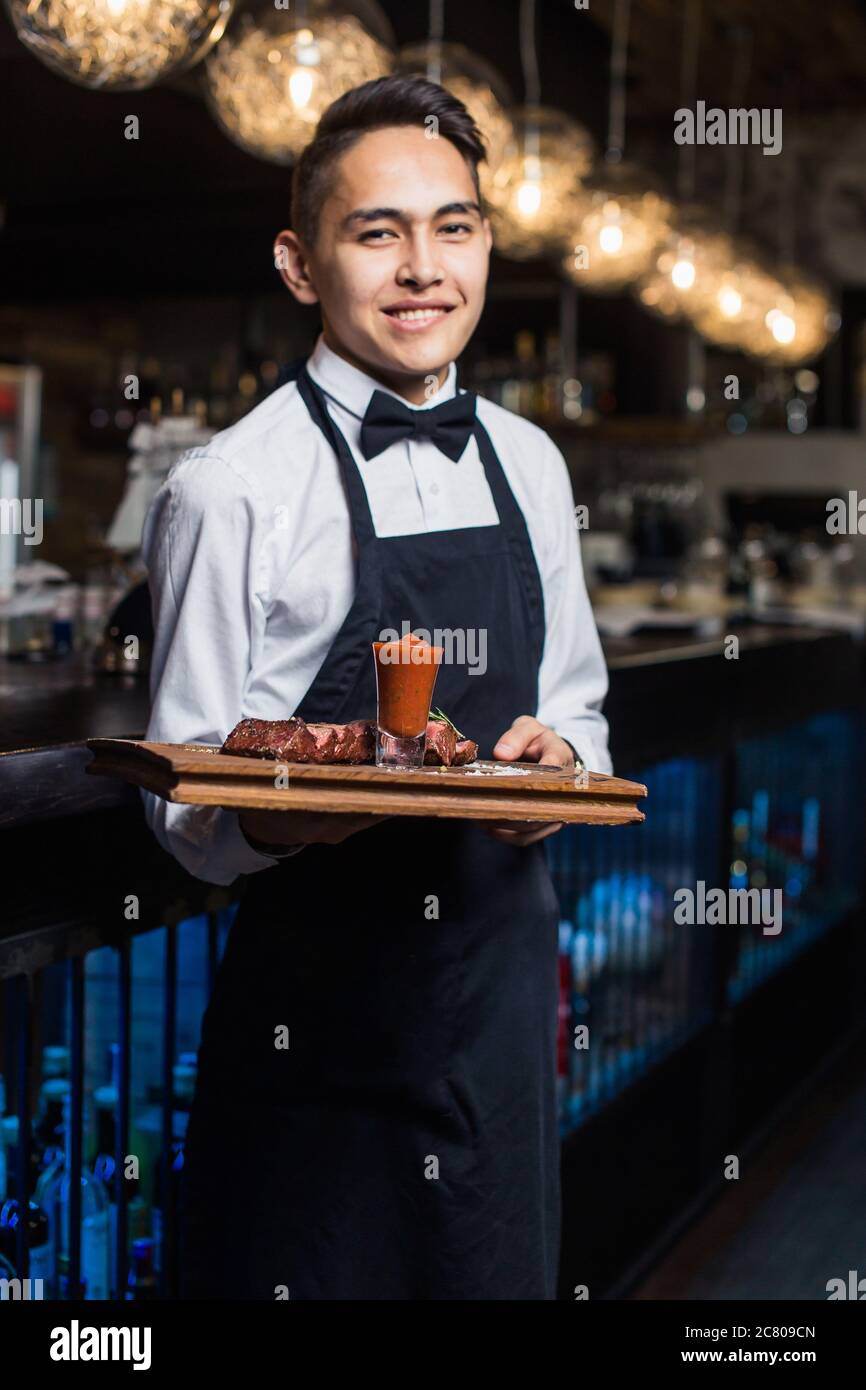 Woman restaurant ordering food waiter hi-res stock photography and ...